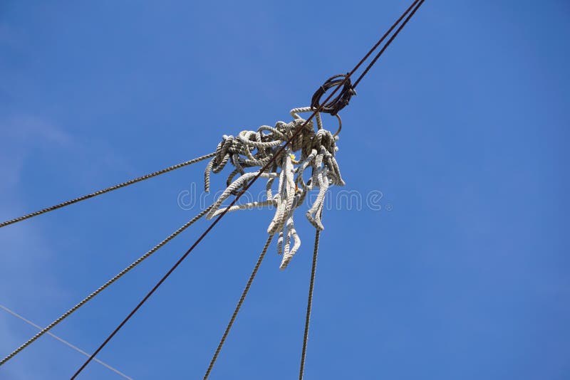 Three Red Ropes Attached To a Metal Ring. Stock Photo - Image of ...