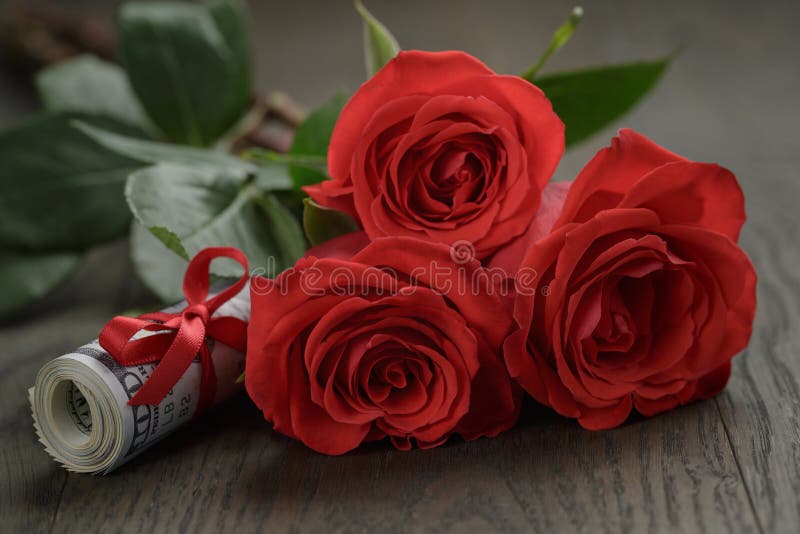 Three Red Roses and Bunch of Dollars Stock Photo - Image of bill ...