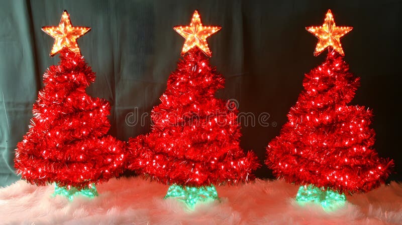 Three Red Tinsel Christmas Trees with Lights Royalty Free Image Stock ...