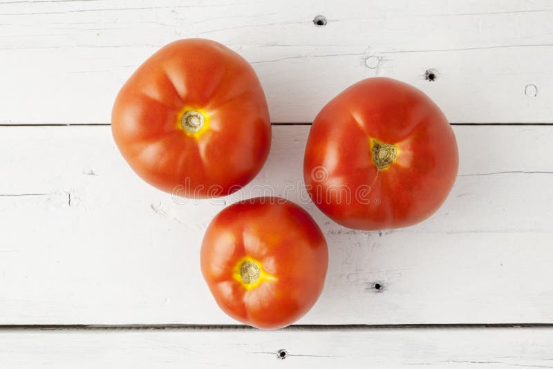 Three red tomatoes stock image. Image of table, freshness - 42458257