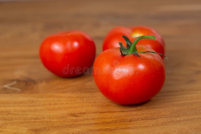 Three Red Tomatoes in Kitchen Table Stock Image - Image of healthy ...