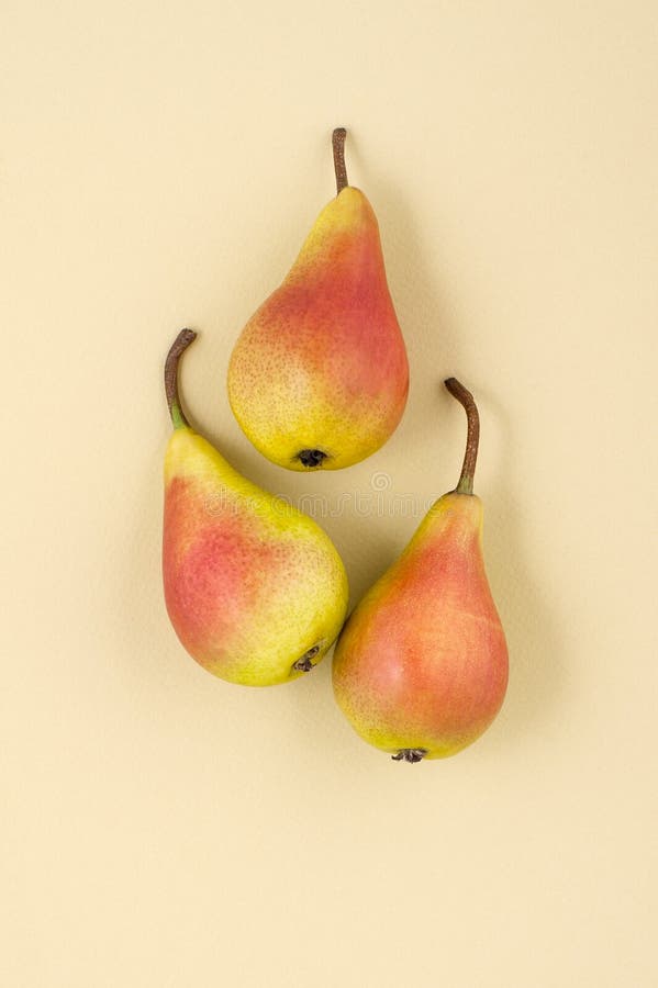 Three Ripe Pears on a Light Yellow Pastel Background. Stock Photo ...