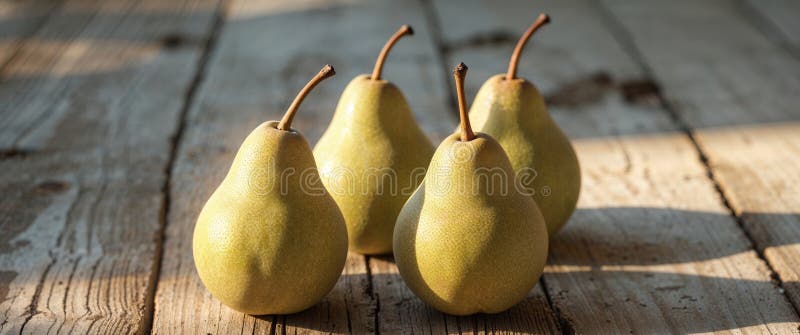 Three Ripe Pears on Rustic Wooden Surface Bathed in Sunlight Stock ...