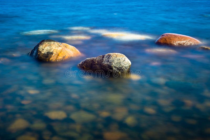 Three Rocks in the Calm Water Stock Image - Image of relaxation ...