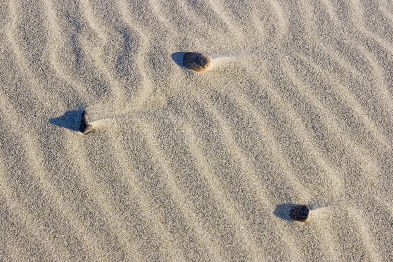 Three rocks in desert sand stock image. Image of effect - 4759479