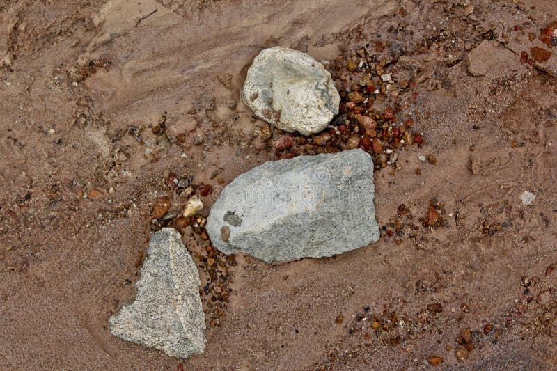 Three Rocks Which are Hand Carved Tools Laying in the Soil Stock Image ...