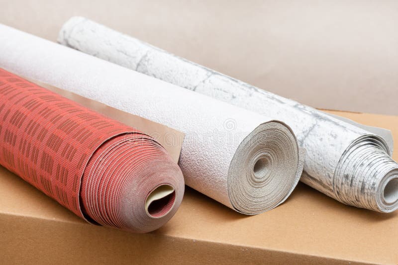 Three Rolls of Wallpaper in Various Colors and Textures. Home ...