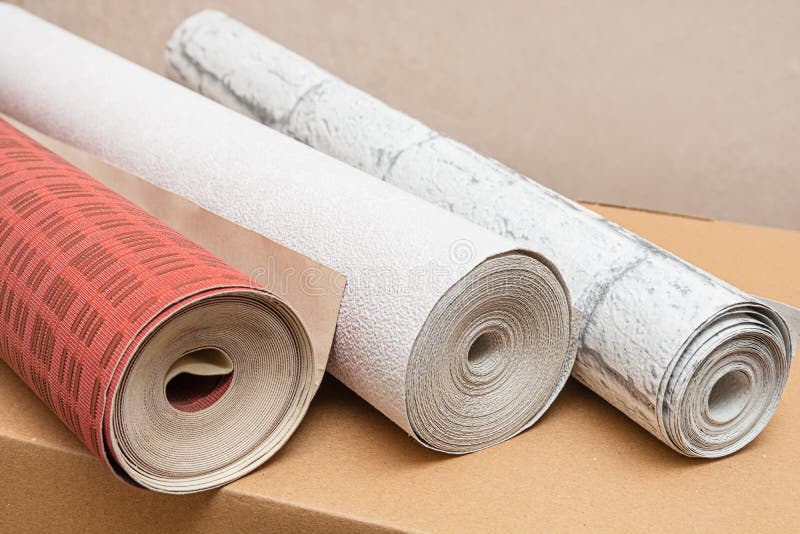 Three Rolls of Wallpaper in Various Colors and Textures. Home ...