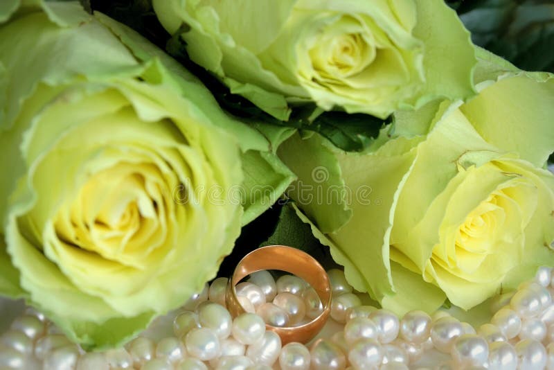Three Roses and a Wedding Ring Stock Photo - Image of jewelry, full ...