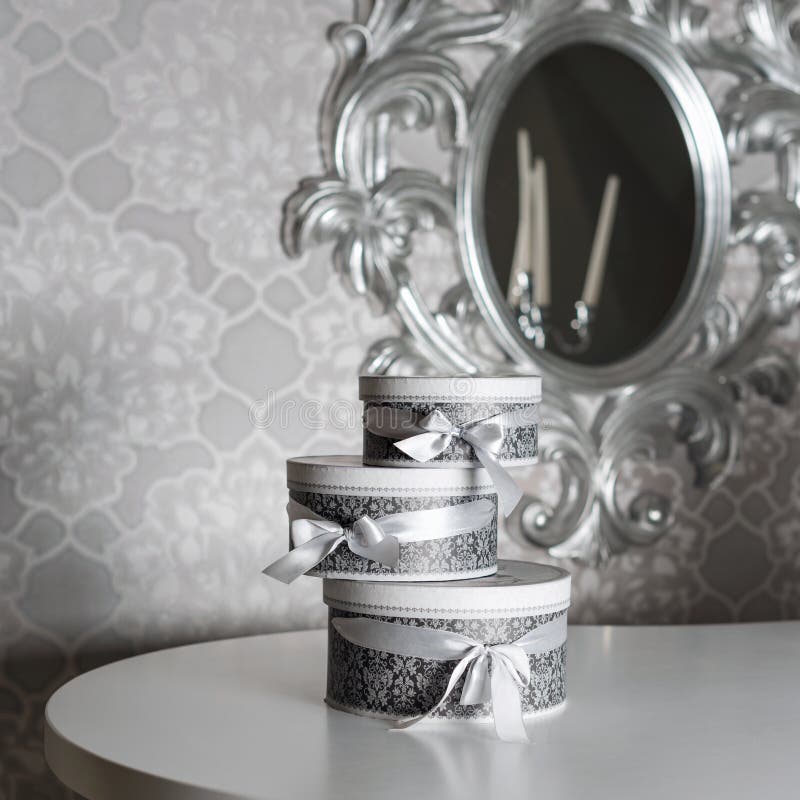 Three Round Celebration Gift Boxes with Silver Ribbon Bows on White ...