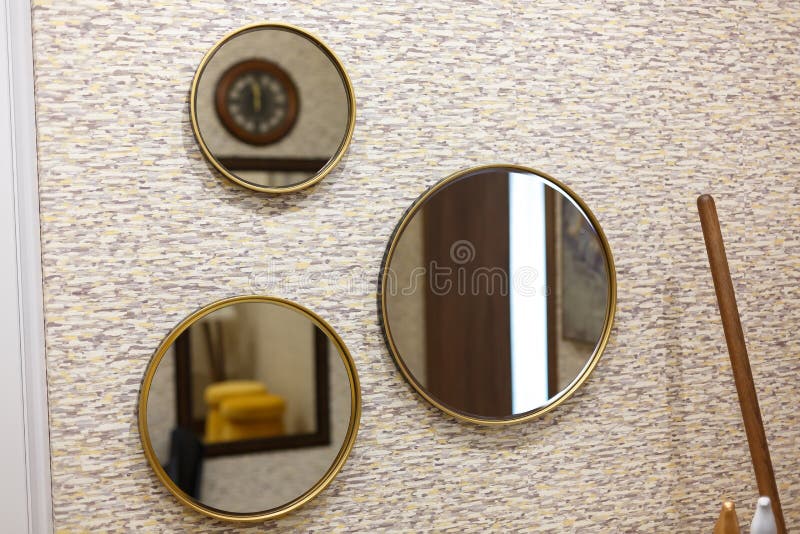 Three Round Mirrors on the Wall in the Hallway Stock Photo - Image of ...