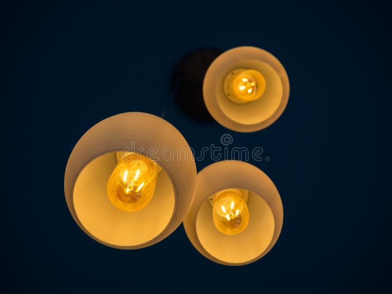 Three Round Modern Ceiling Lights Hanging from Ceiling from Bottom View ...