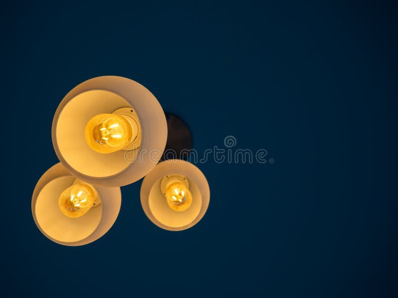 Three Round Modern Ceiling Lights Hanging from Ceiling from Bottom View ...