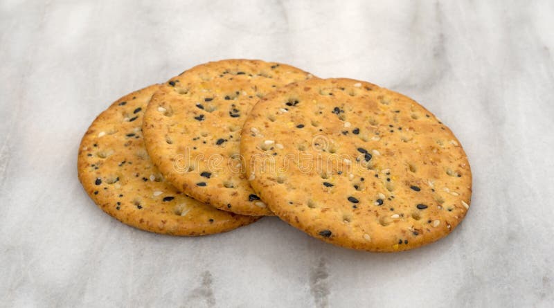 Three Multi Grain Crackers on a Cutting Board Stock Photo - Image of ...