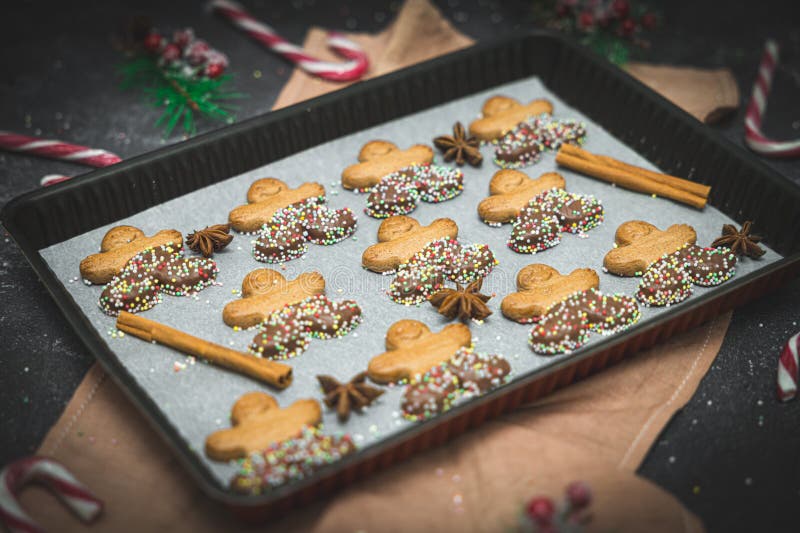 Three Rows of Gingerbread Men with Chocolate and Sprinkles on White ...