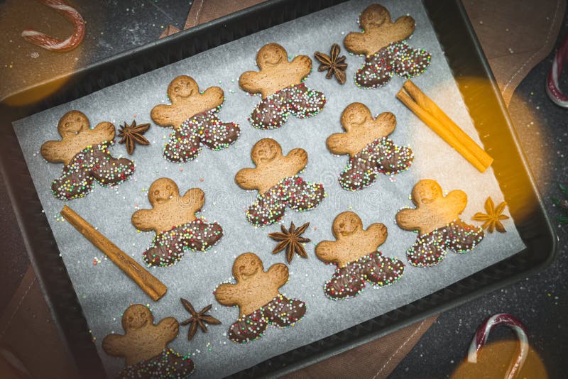 Three Rows of Gingerbread Men with Chocolate and Sprinkles on White ...