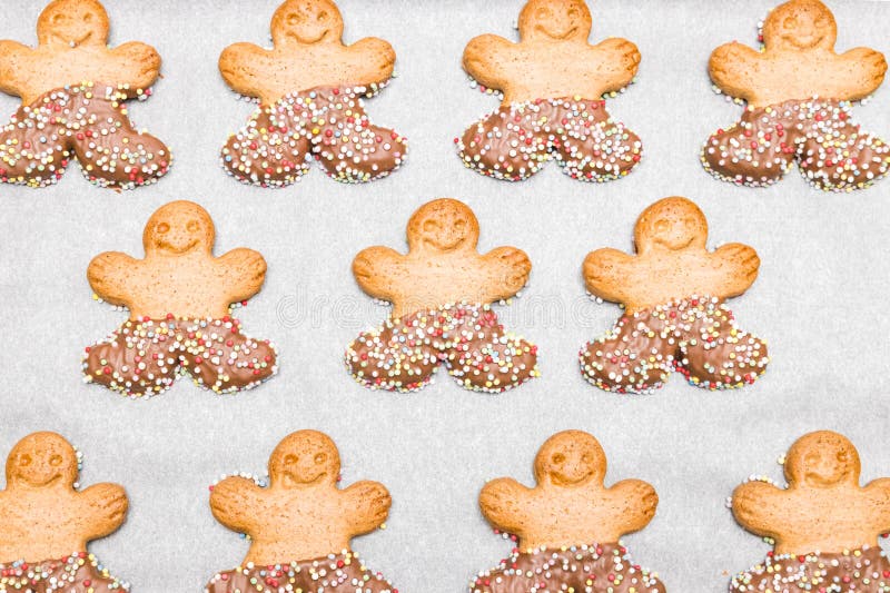 Three Rows of Gingerbread Men on White Baking Paper. Stock Image ...