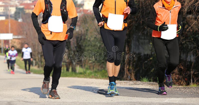 Three Runners Run on Asphalt Road Outdoors Stock Photo - Image of ...