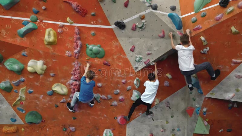 Three 10s Boys Climb Up the Climbing Wall with Tenacity and ...