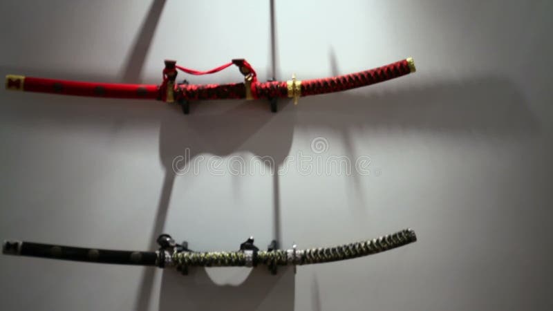 Three Samurai Swords Hang on White Wall in Stock Video - Video of ...