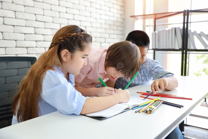 Three School Kids Drawing in Class Education Concept Stock Image ...