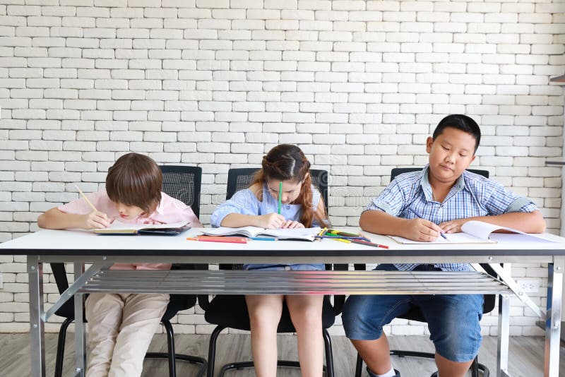 Three School Kids Drawing in Class Education Concept Stock Image ...