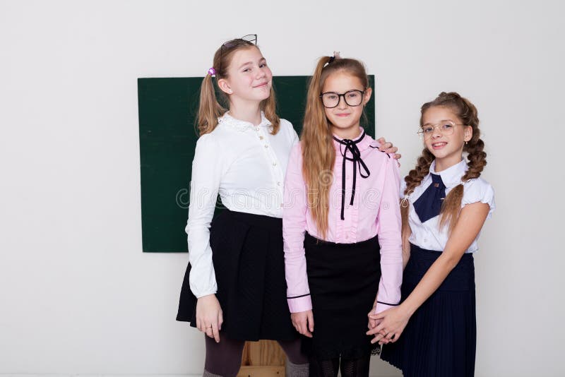 Three Schoolgirls in Class at the School Board Stock Photo - Image of ...