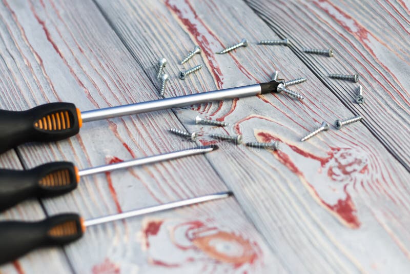 Three Screwdriver or One with Screws in the Shape of a Circle. on a ...