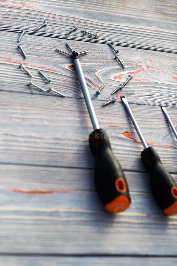 Three Screwdriver Or One With Screws In The Shape Of A Circle On A