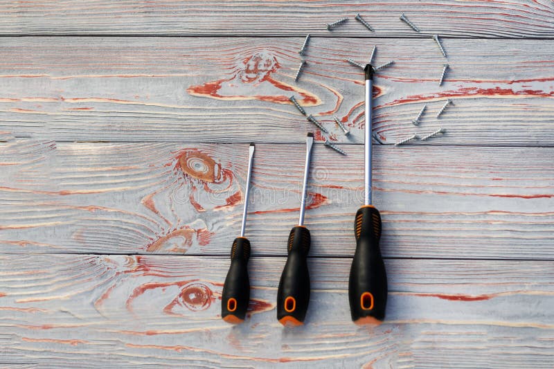 Three Screwdriver or One with Screws in the Shape of a Circle. on a ...