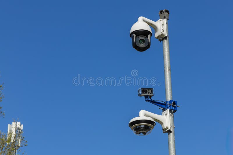 Three Security Cameras on a Pole. Stock Photo - Image of scanning ...