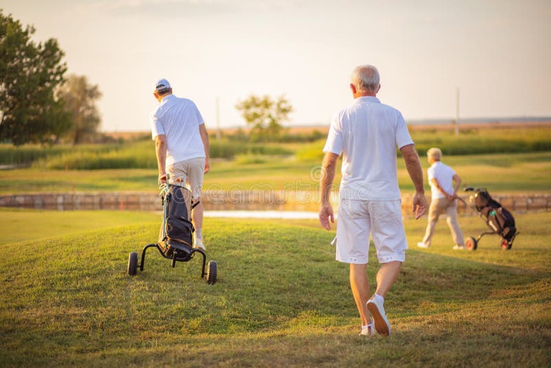 Three Senior Golfer on Filed. Man Playing Golf Stock Image - Image of ...