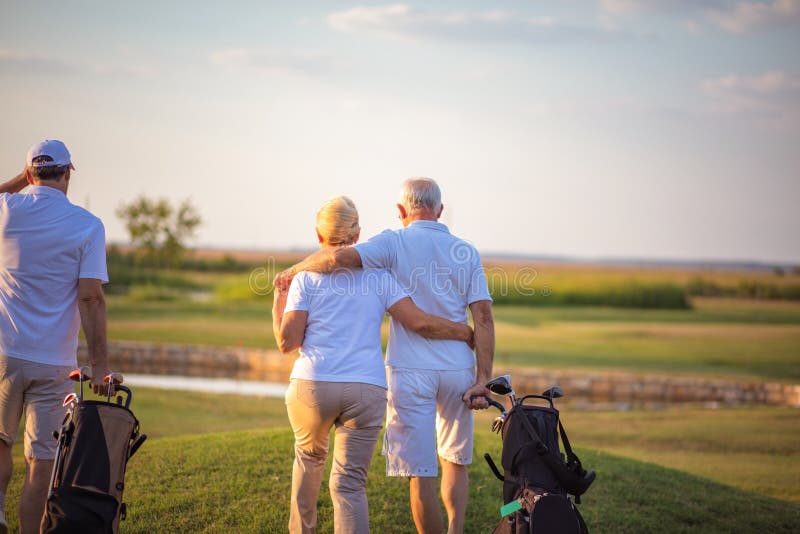 Golfers Walking on the Golf Course Stock Image - Image of picturesque ...
