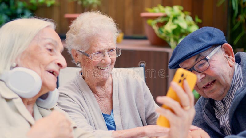 Three Senior People of a Geriatric Using Phone Stock Image - Image of ...