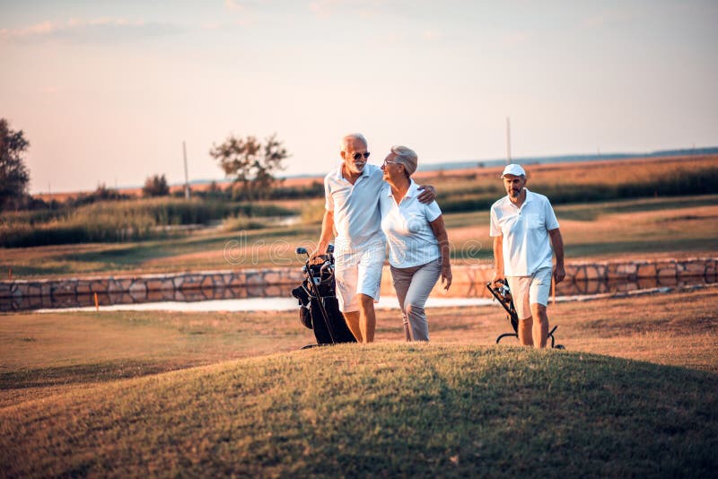 Seniors Golfers Having Fun on Golf Field Stock Image - Image of ...