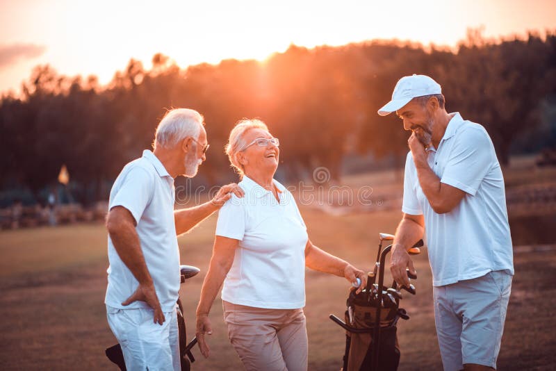 Seniors Golfers Talking on Golf Field Stock Image - Image of golfer ...