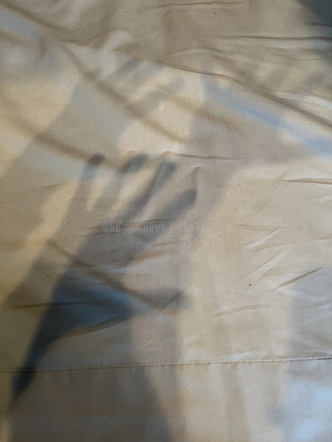 Three Shadows of a Hand on Light-colored Sheet Stock Image - Image of ...