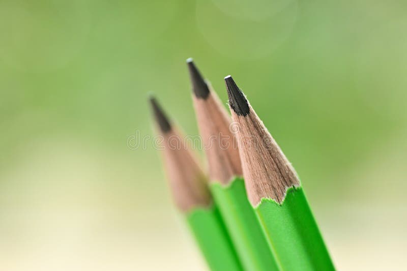 Three Sharp Green Wooden Pencil on Blur Nature Background with Bokeh ...