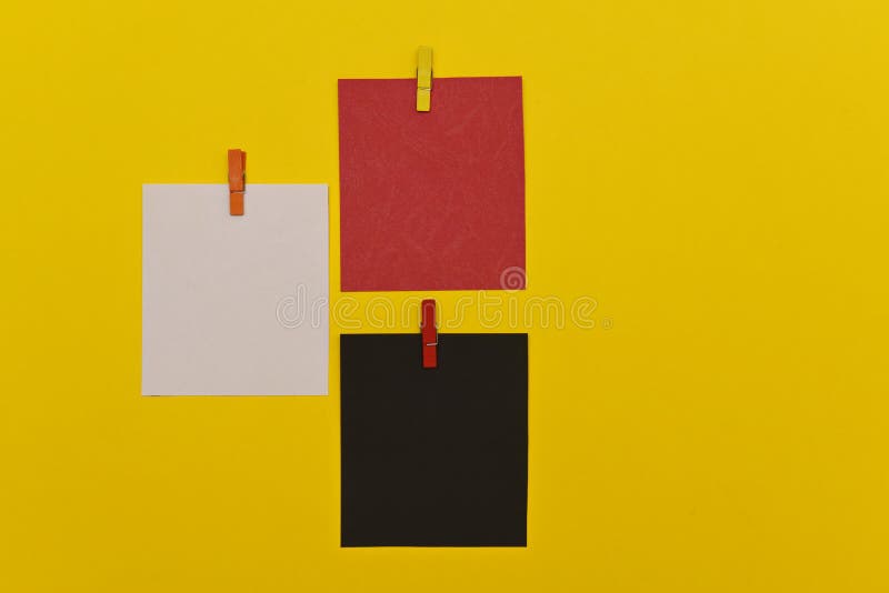 Three Sheets of Colored Paper on a Yellow Background Stock Image ...