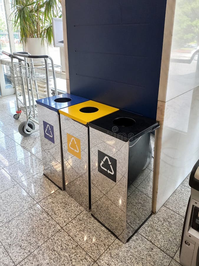 Three Shiny Metal Bins for Separate Collection of Garbage on the ...