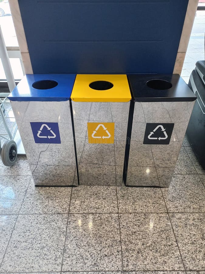 Three Shiny Metal Bins for Separate Collection of Garbage on the ...
