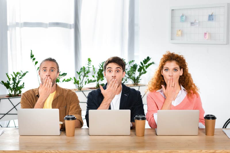 Three Shocked Friends Sitting at Table Stock Image - Image of european ...