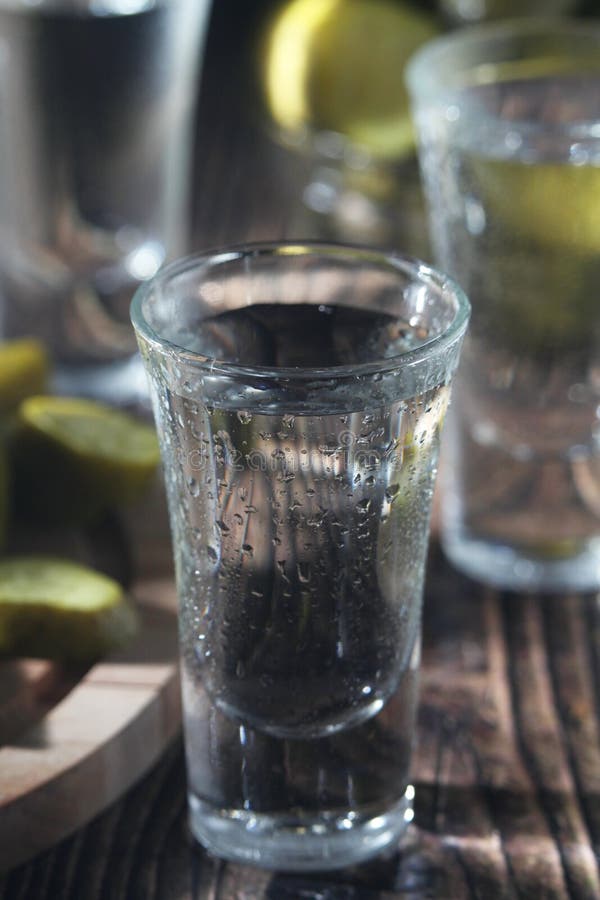 Three Shots with Vodka and Pickled Cucumbers Stock Image - Image of ...