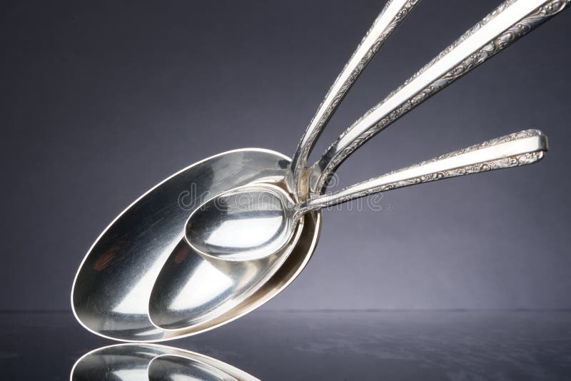 Three Silver Spoons in Balance Stock Image - Image of posh, support ...