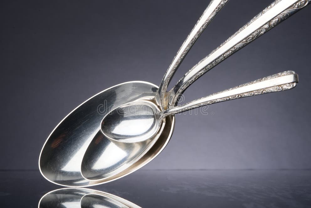 Three Silver Spoons in Balance Stock Image - Image of posh, support ...