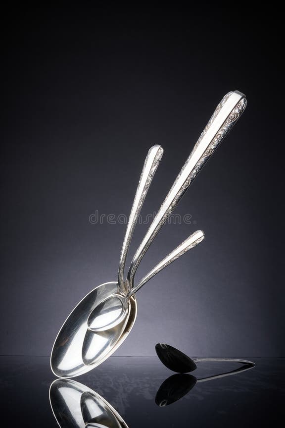 Three Silver Spoons in Balance Stock Image - Image of unity, classy ...