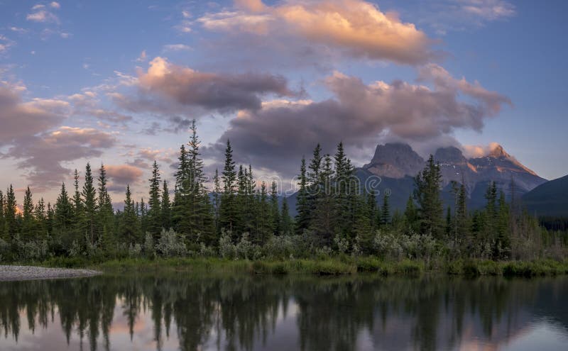 Three Sisters at sunset stock photo. Image of river, three - 95797880