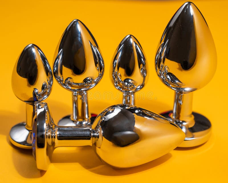 Three Size Steel Plugs on an Orange Background. Stock Photo - Image of ...