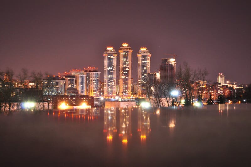 Three Skyscrapers at Night and Reflection Stock Photo - Image of ...