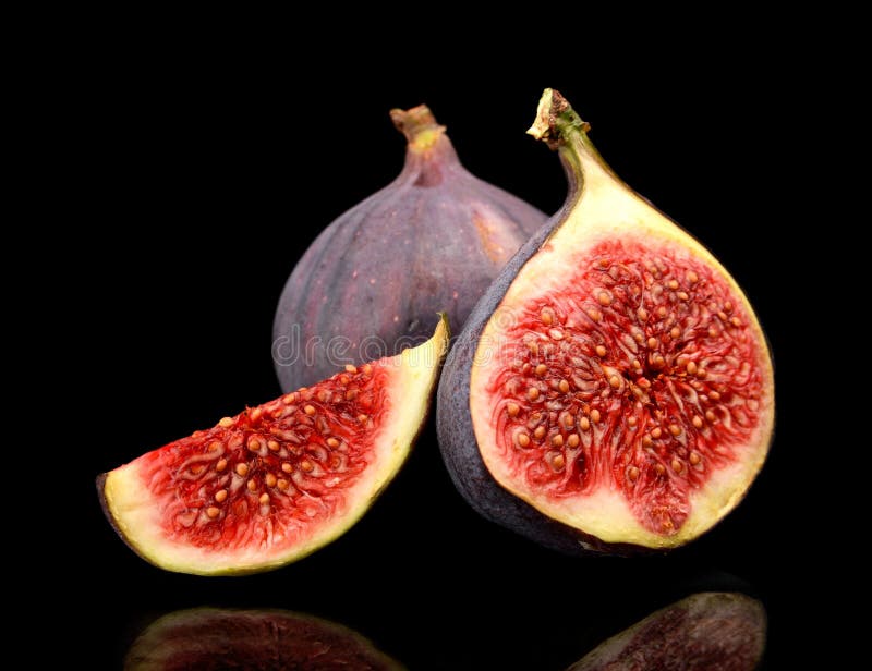 Three Figs Split Like Flower on Black Background Stock Image - Image of ...